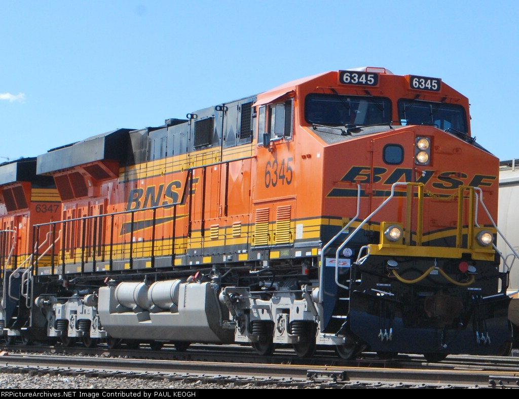 BNSF 6345 Very New and Very Clean leads another brand new GEVO BNSF 6347 north throught downtown ...